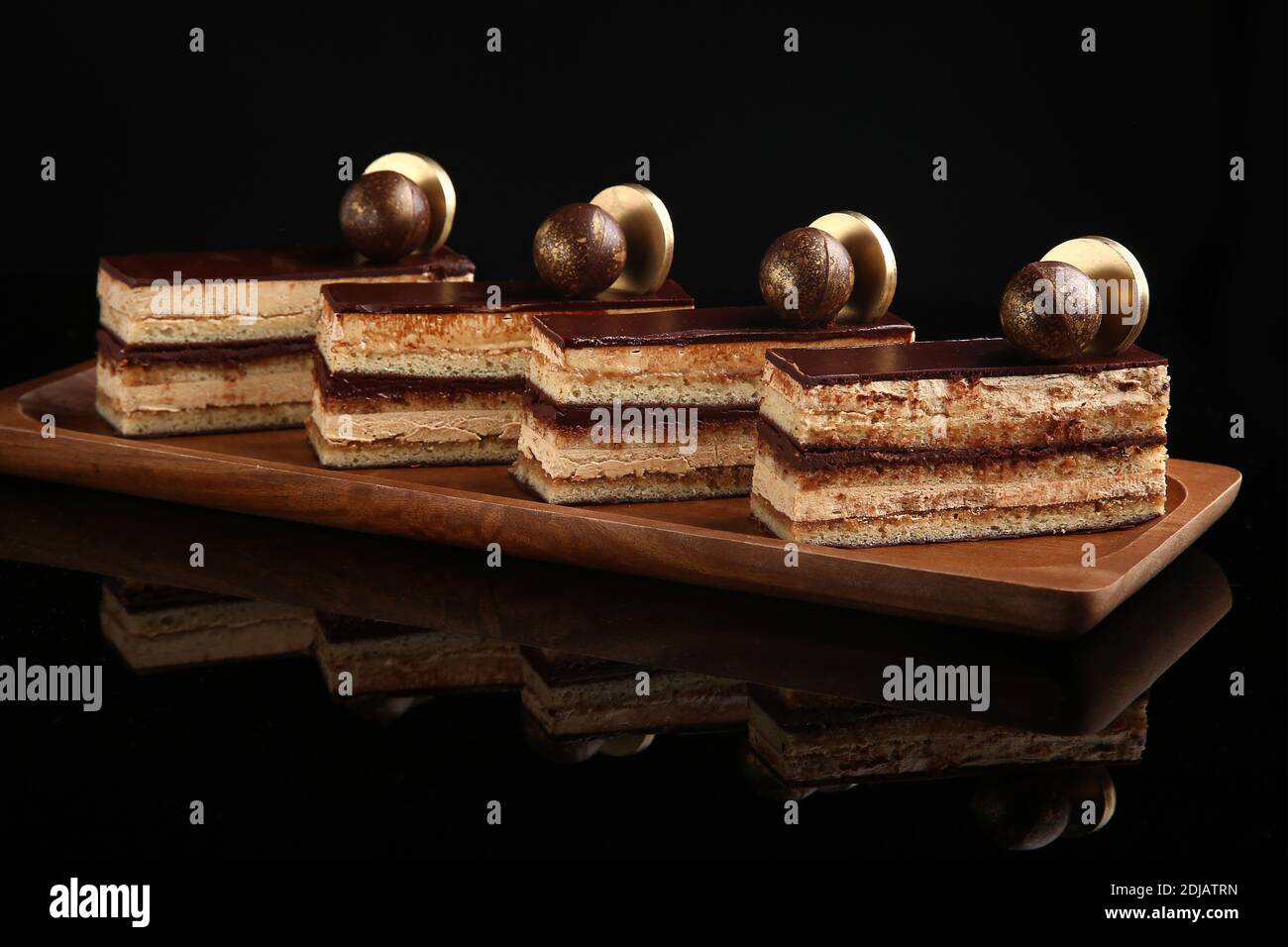 Opera cake at the a La carte desserts , cakes on a black background ...