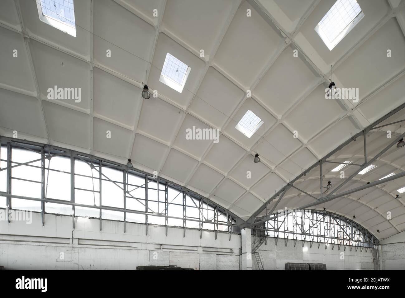 Hemispherical reinforced concrete load bearing roof with windows in ...