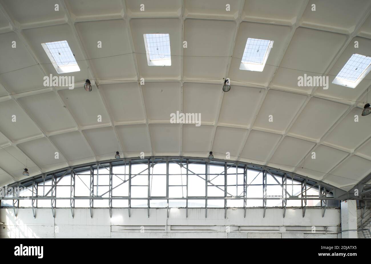 Hemispherical reinforced concrete load bearing roof with windows in ...