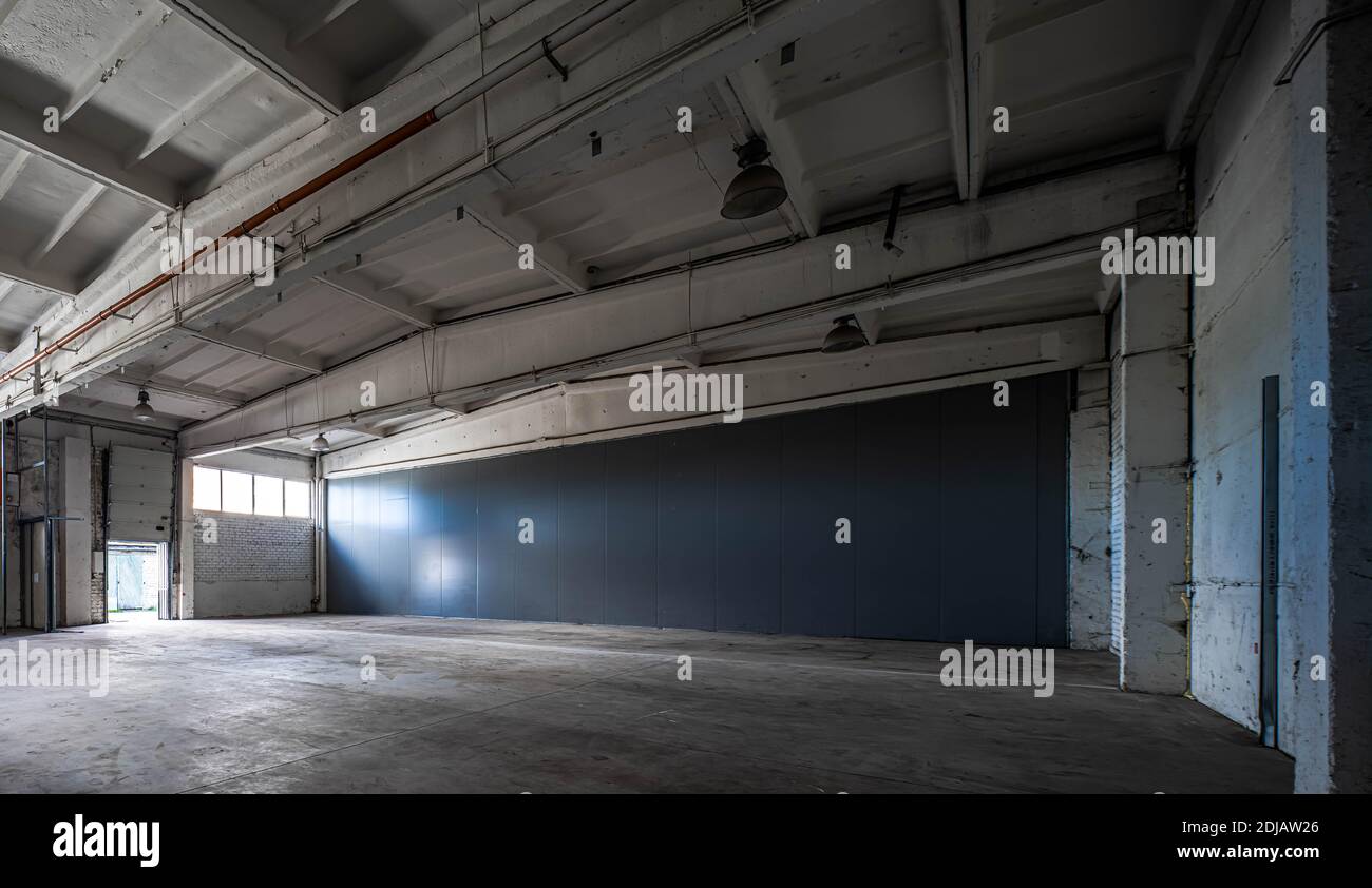 Modern interior of huge empty concrete industrial warehouse. White ...