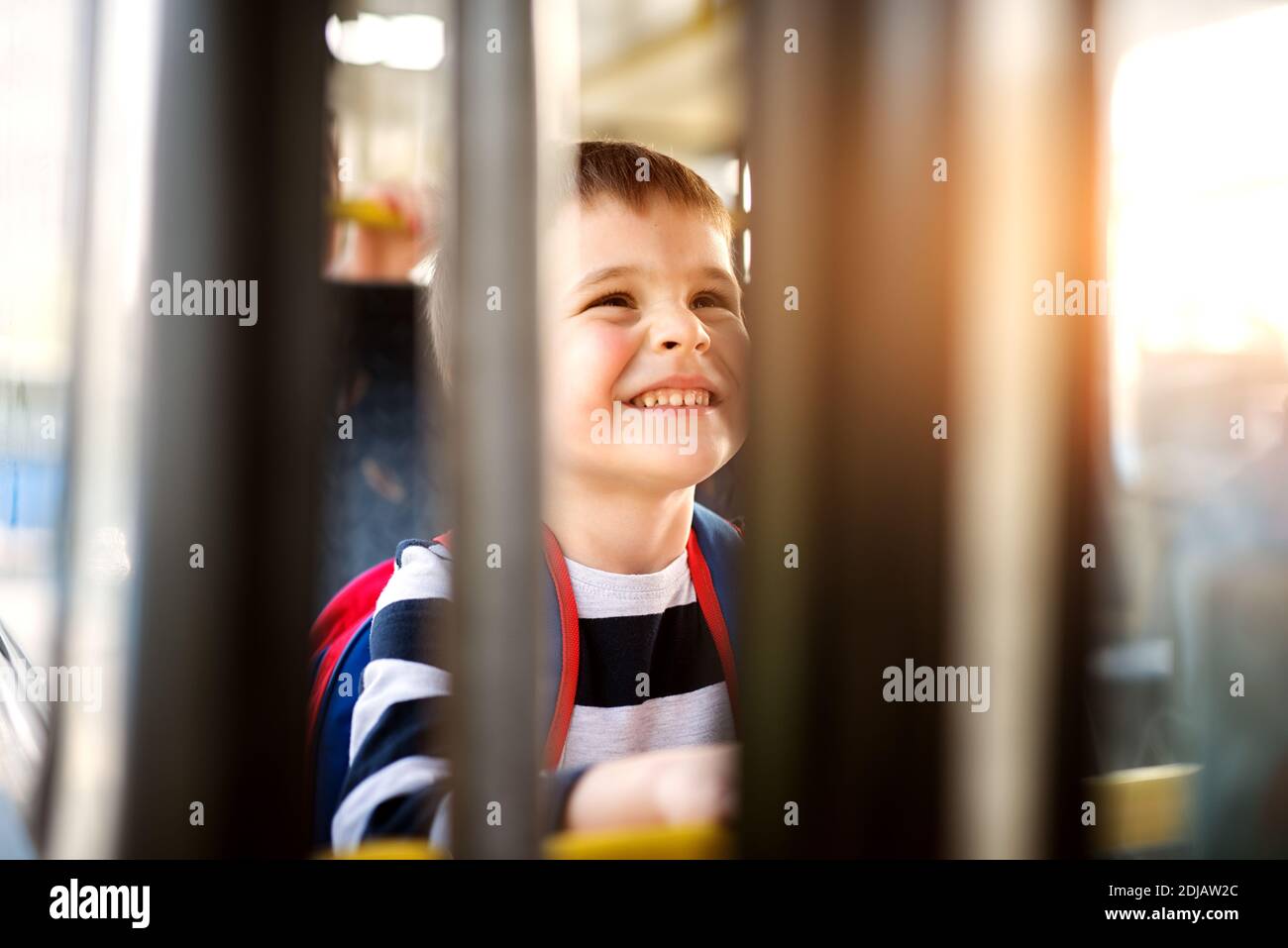 Child looking through bus window hi-res stock photography and images ...