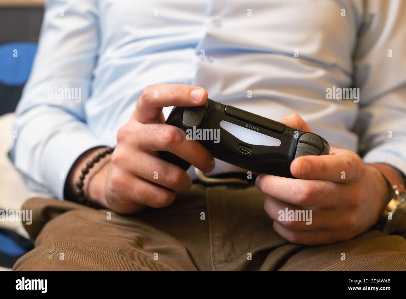 Hand holding playstation controller hi-res stock photography and images ...