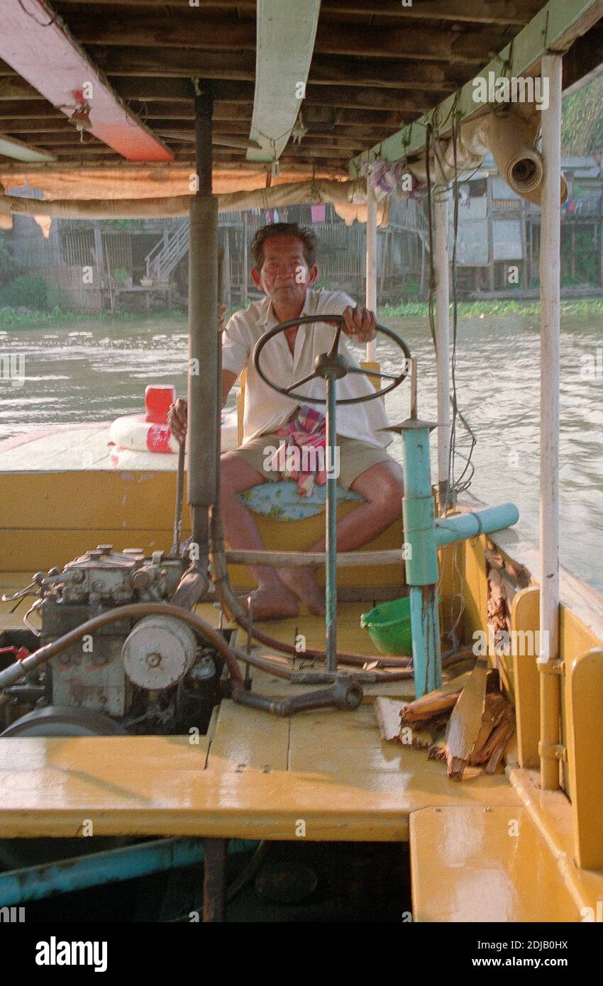 Ferry operator crossing the Chao Phraya at Ayutthya, Thailand Stock ...