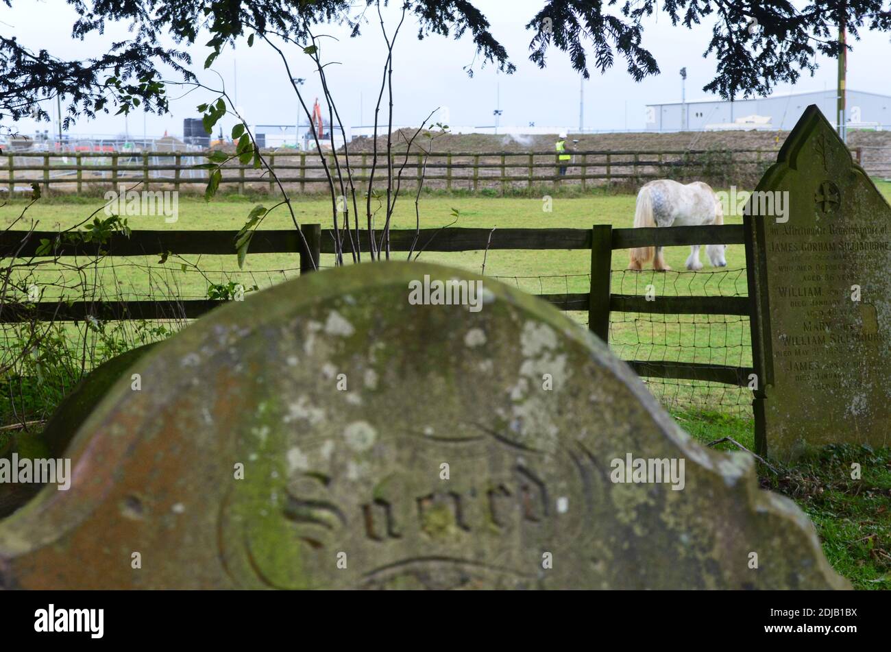 Ashford, UK. 11th Dec, 2020. "Sacred" (holy) is written on a tombstone ...