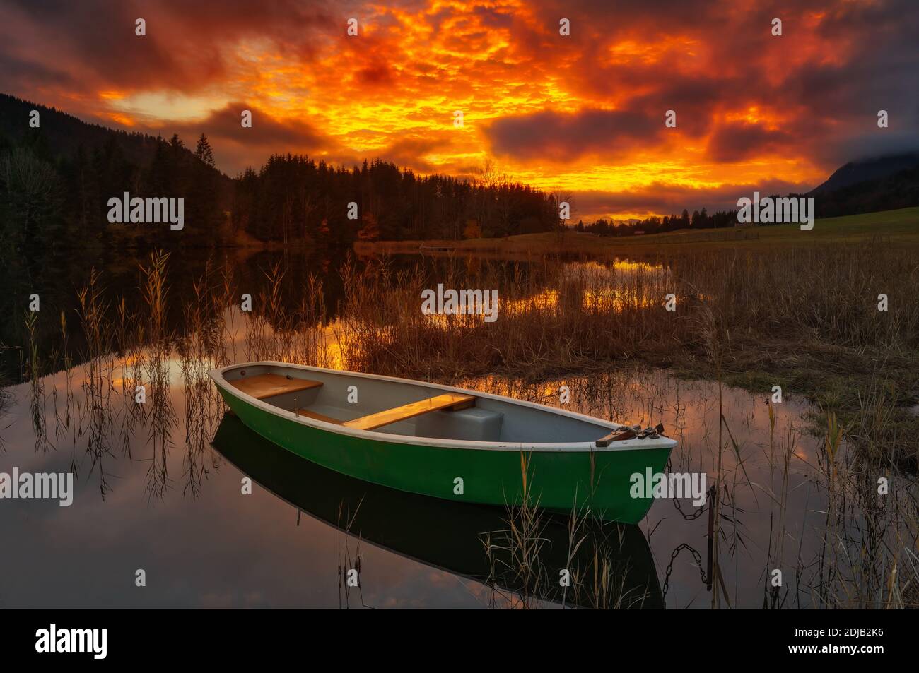 Boat in stunning sunset Stock Photo - Alamy