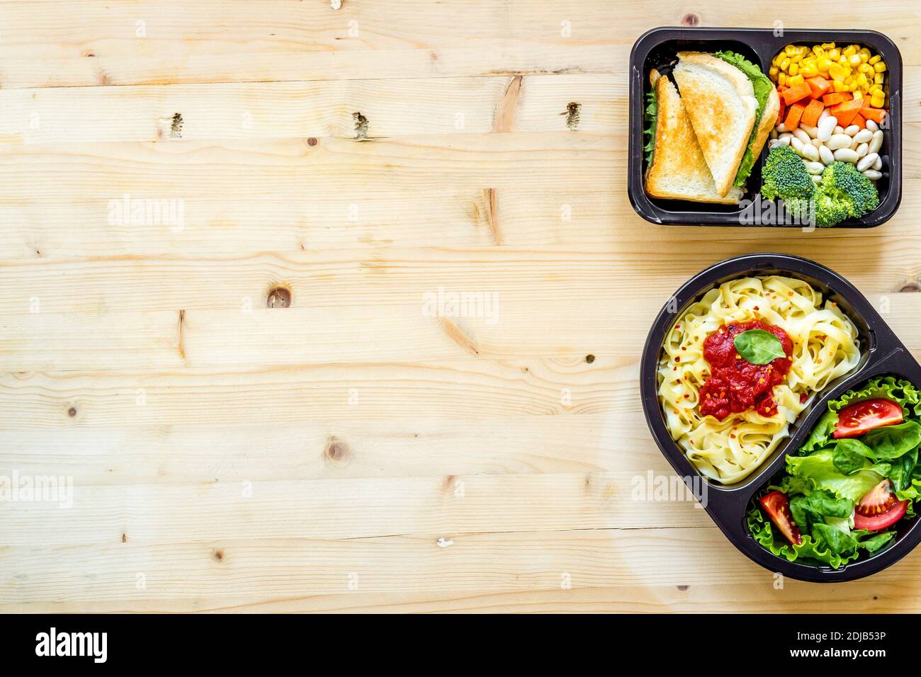 Overhead view of food delivery lunch boxes with meal Stock Photo - Alamy