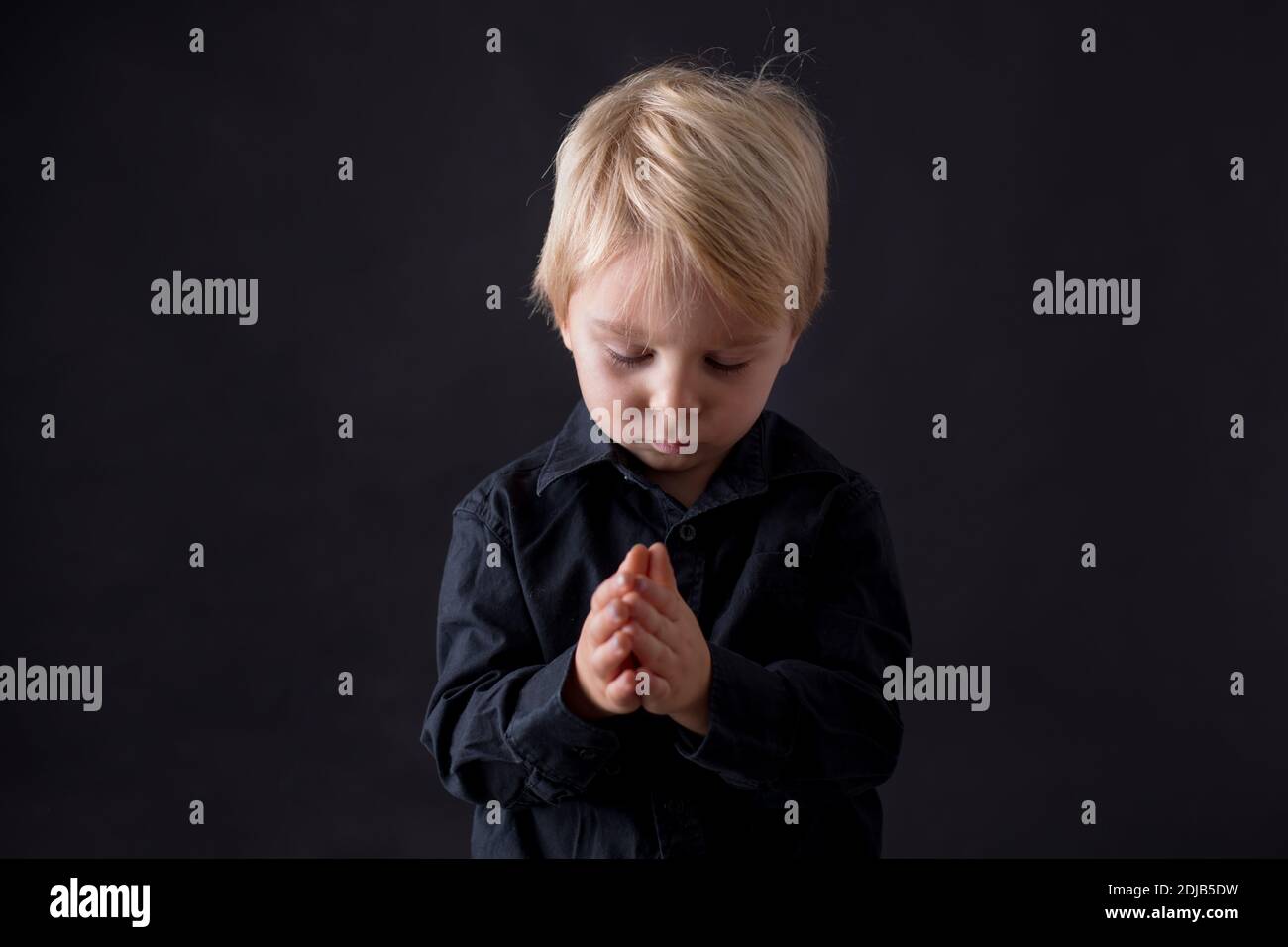 Little toddler child, boy praying, child praying, isolated background ...