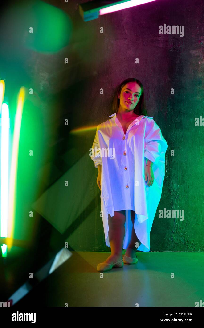 Young. Caucasian female inclusive model posing on studio background in ...