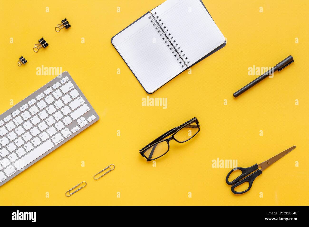 Yellow flat lay top view office table desk with keyboard and office ...