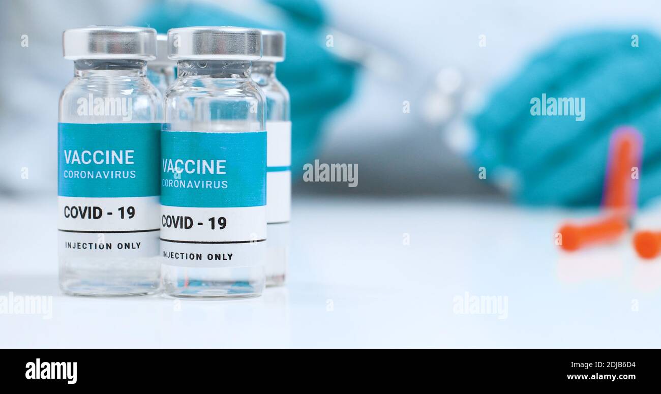 Close-up of female doctor hands in blue medical gloves with transparent ...