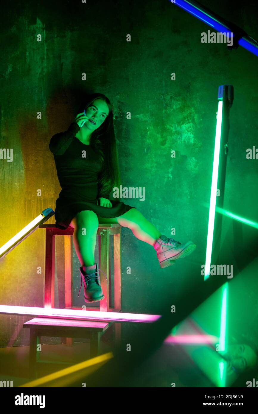 Urban. Caucasian female inclusive model posing on studio background in ...