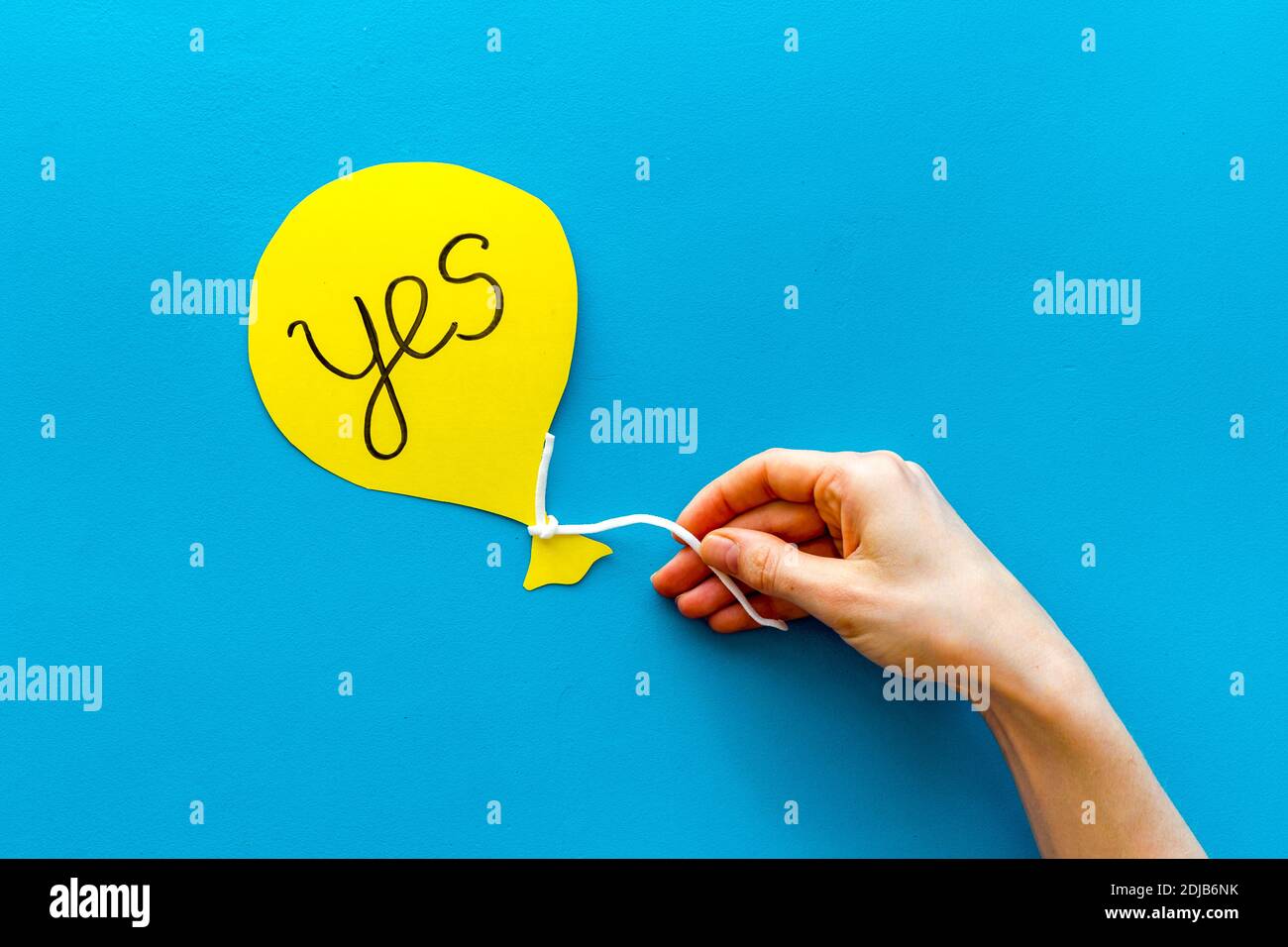 Yes agreement - decision concept. Word Yes on paper banner, top view ...