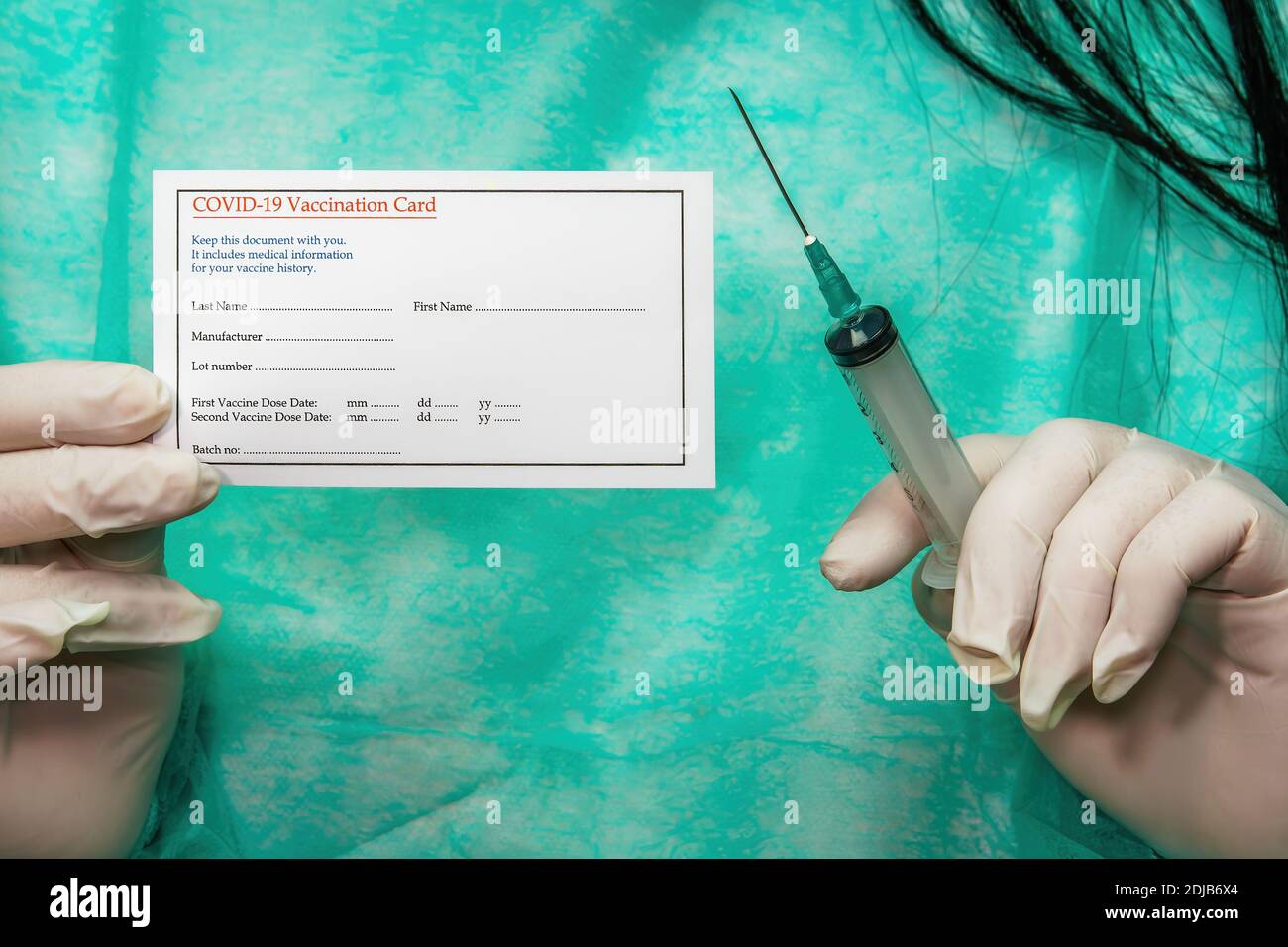 Chemist with suit holds covid-19 vaccination card. Medical concept of ...