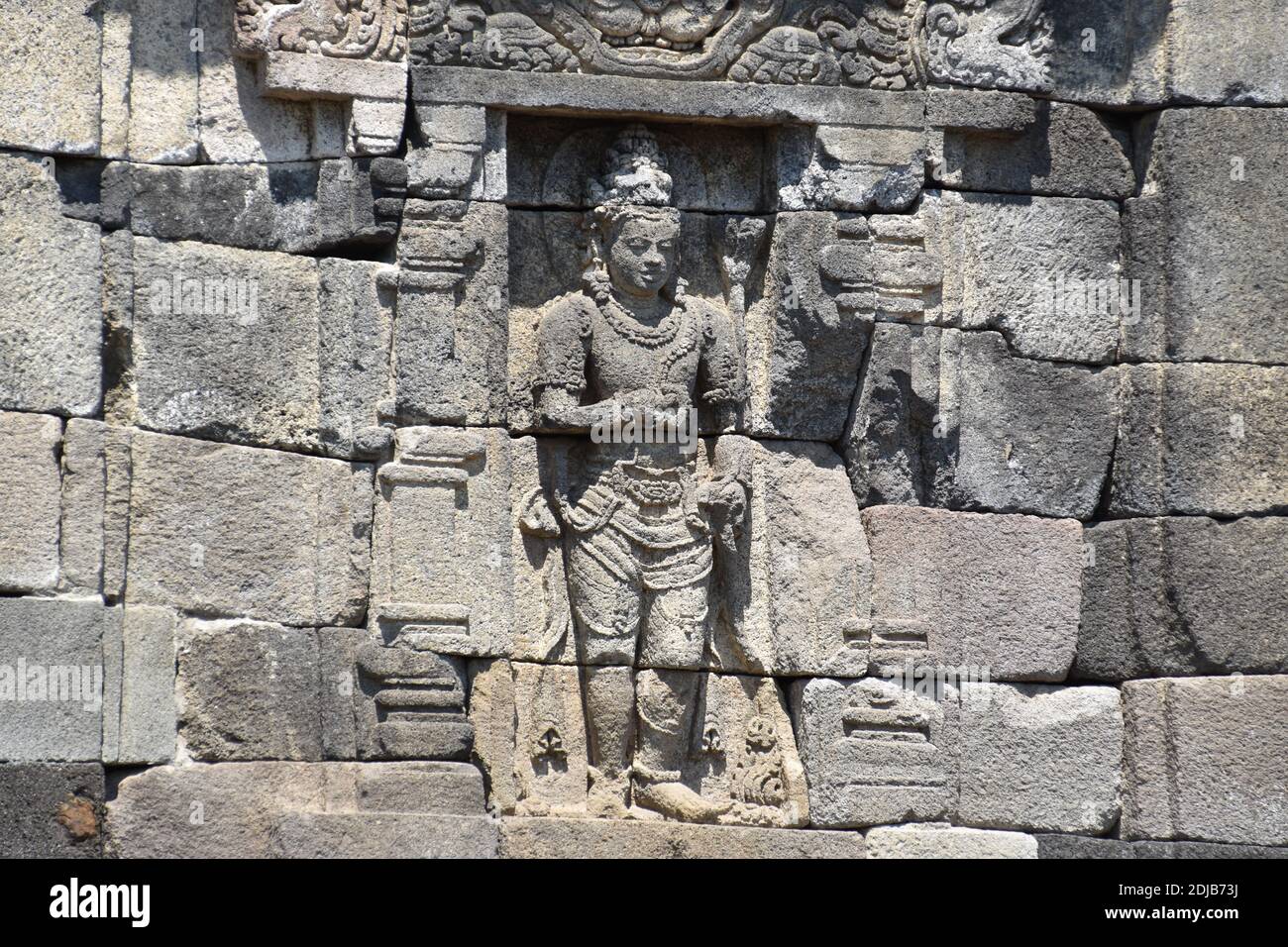 relief of male servant using jatamakuta hats at pervara temple in ...