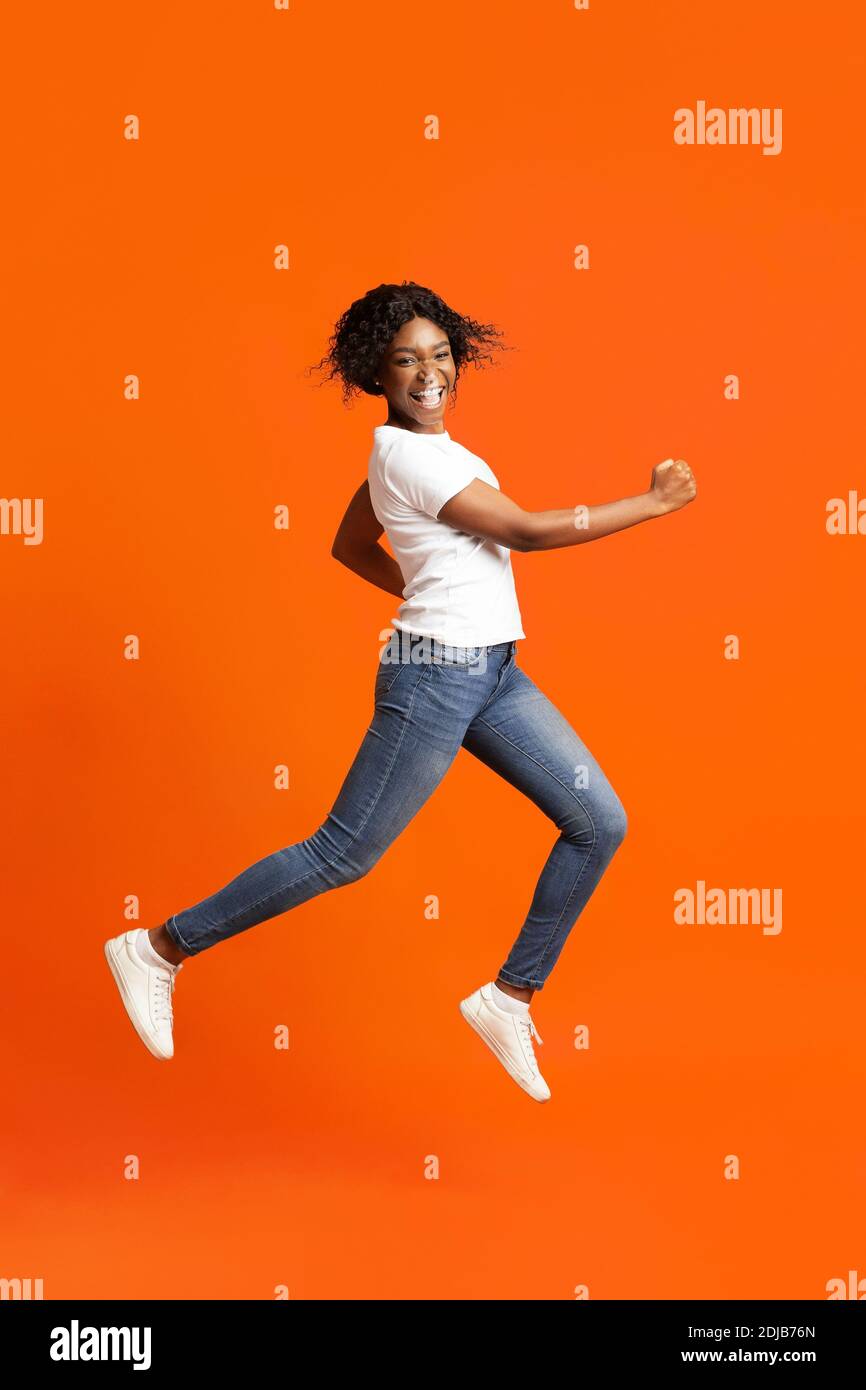 Active woman jumping over hi-res stock photography and images - Alamy