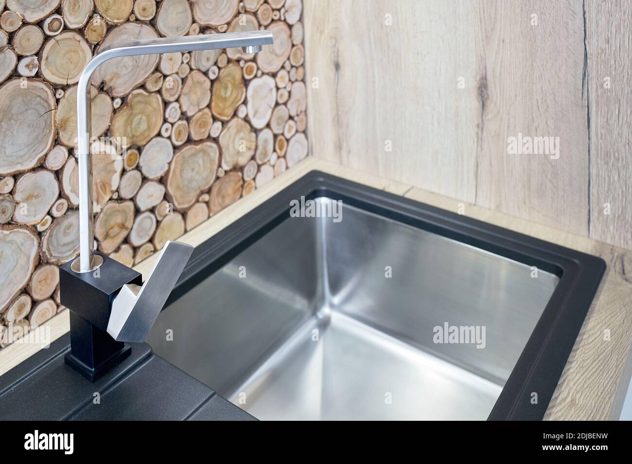 Modern design chrome rectangular section water tap closeup over ...