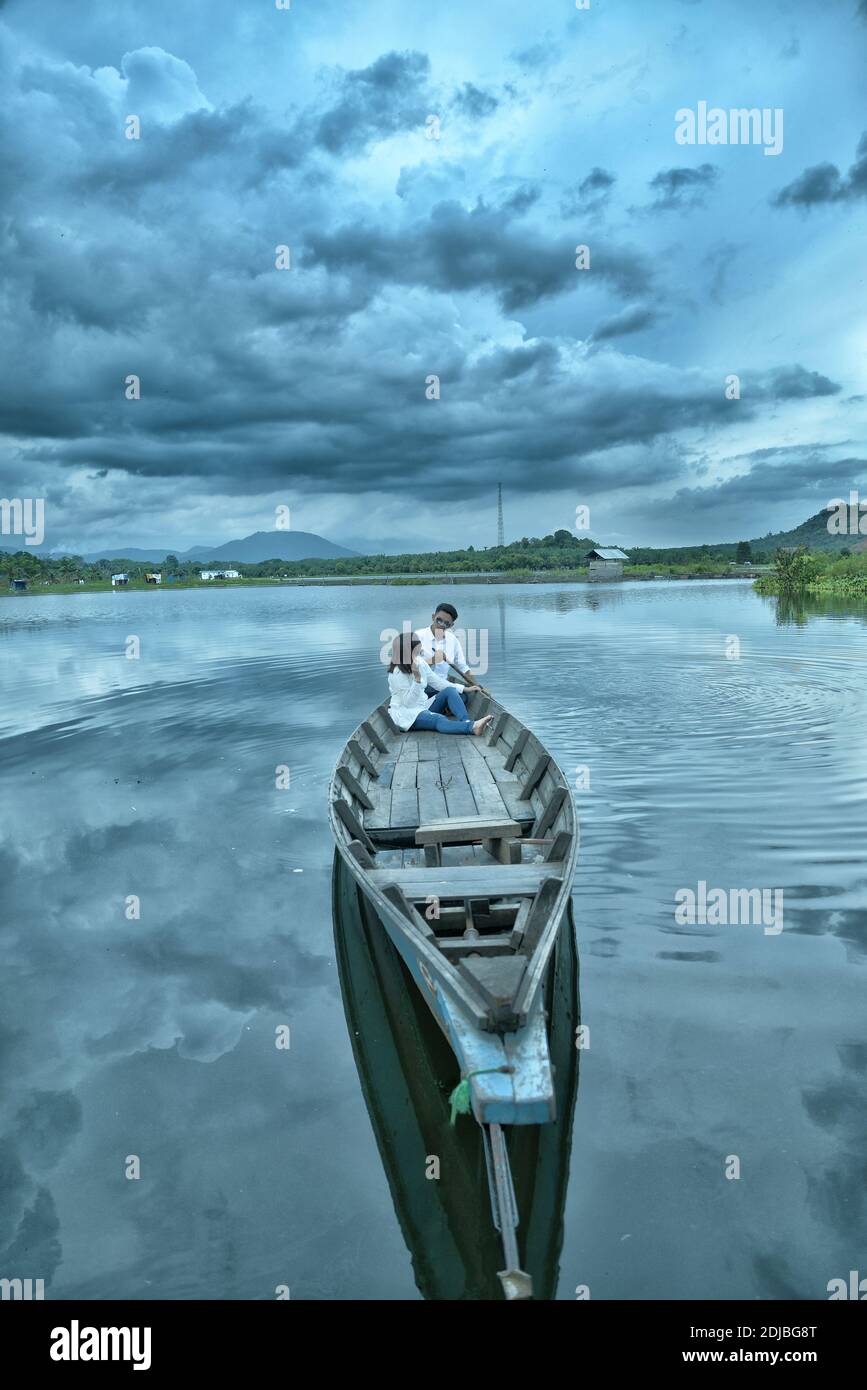 Woman, rowboat, lake, dusk hi-res stock photography and images - Alamy