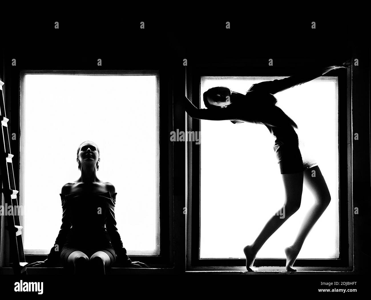 Two women sitting window Black and White Stock Photos & Images - Alamy