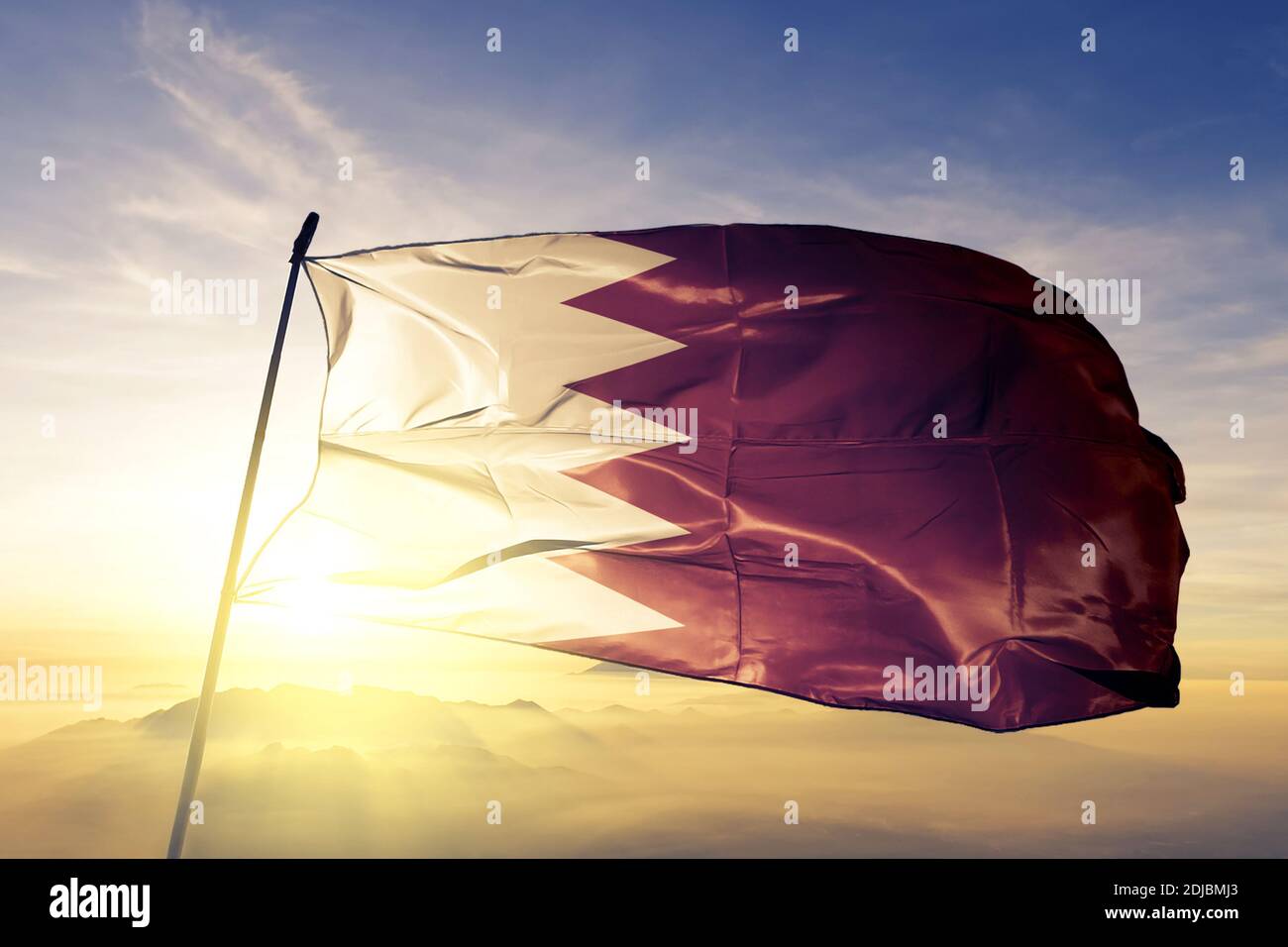Bahrain flag waving on the top sunrise mist fog Stock Photo - Alamy
