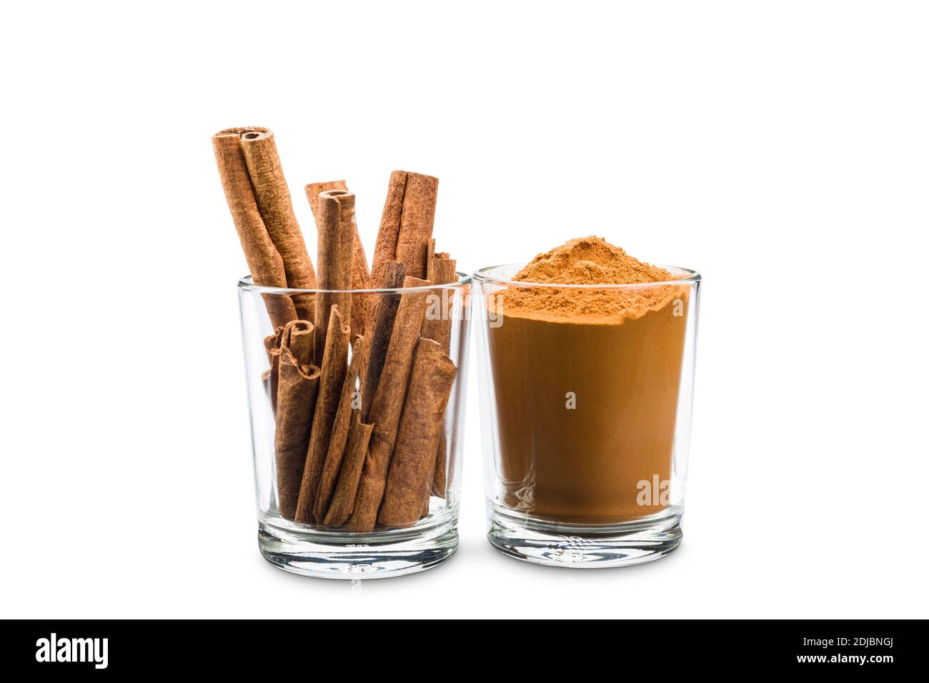 glass jars with ground cinnamon and sticks on white background Stock ...