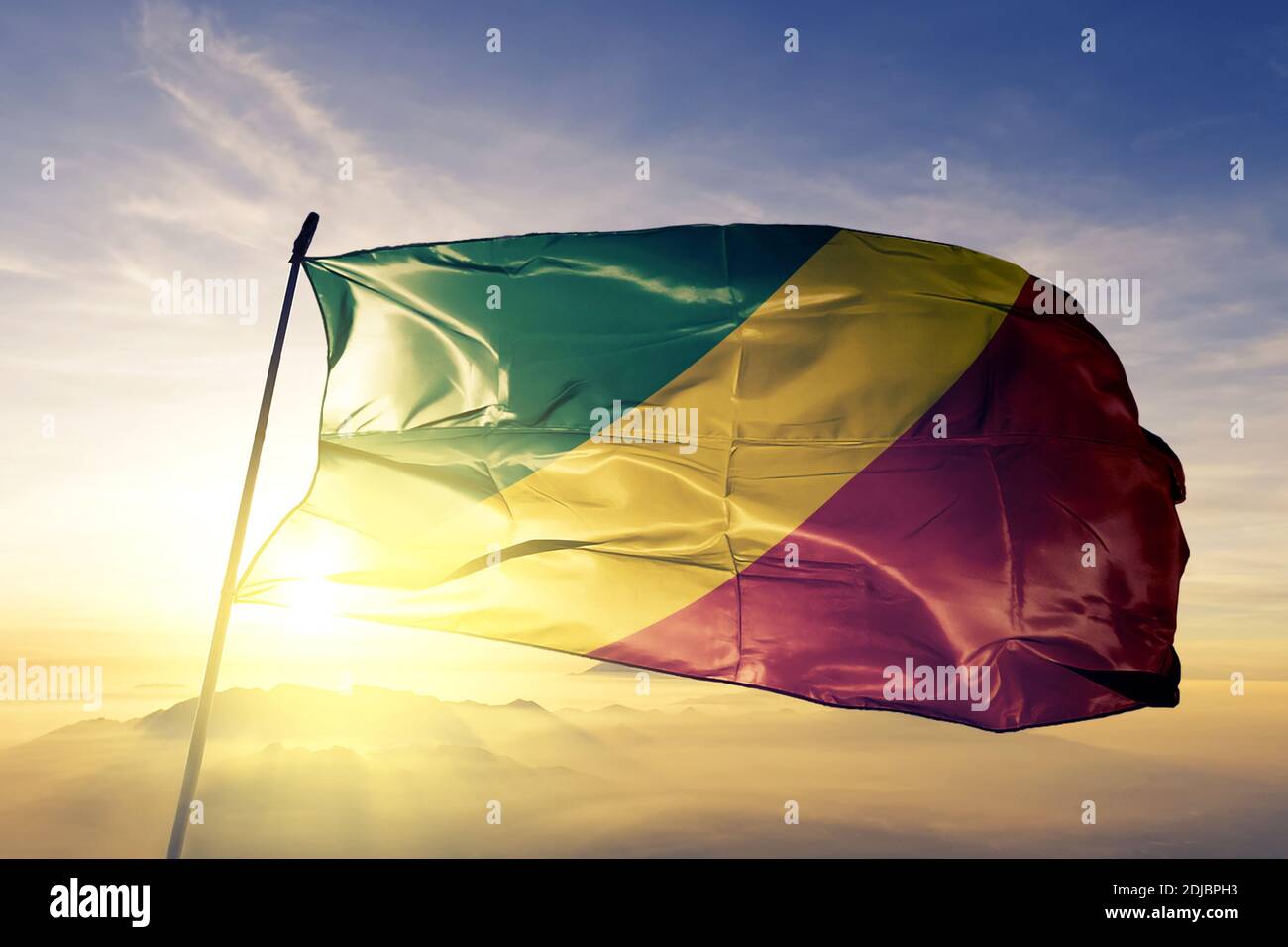 Congo flag waving on the top sunrise mist fog Stock Photo - Alamy