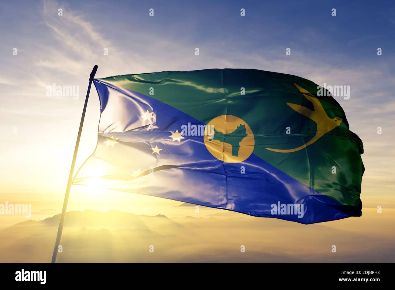 Christmas Island flag waving on the top sunrise mist fog Stock Photo ...