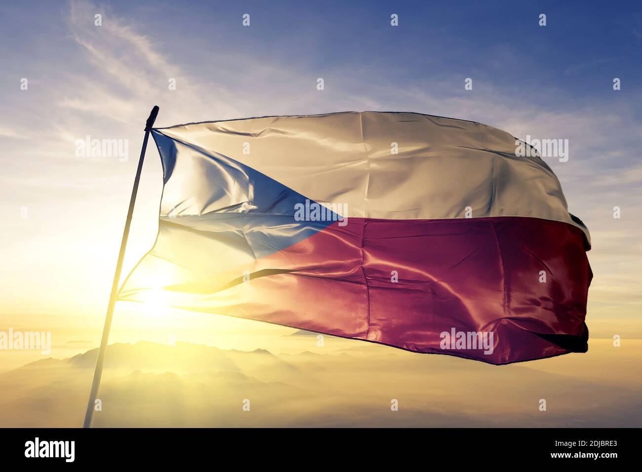 Czech Republic flag waving on the top sunrise mist fog Stock Photo - Alamy