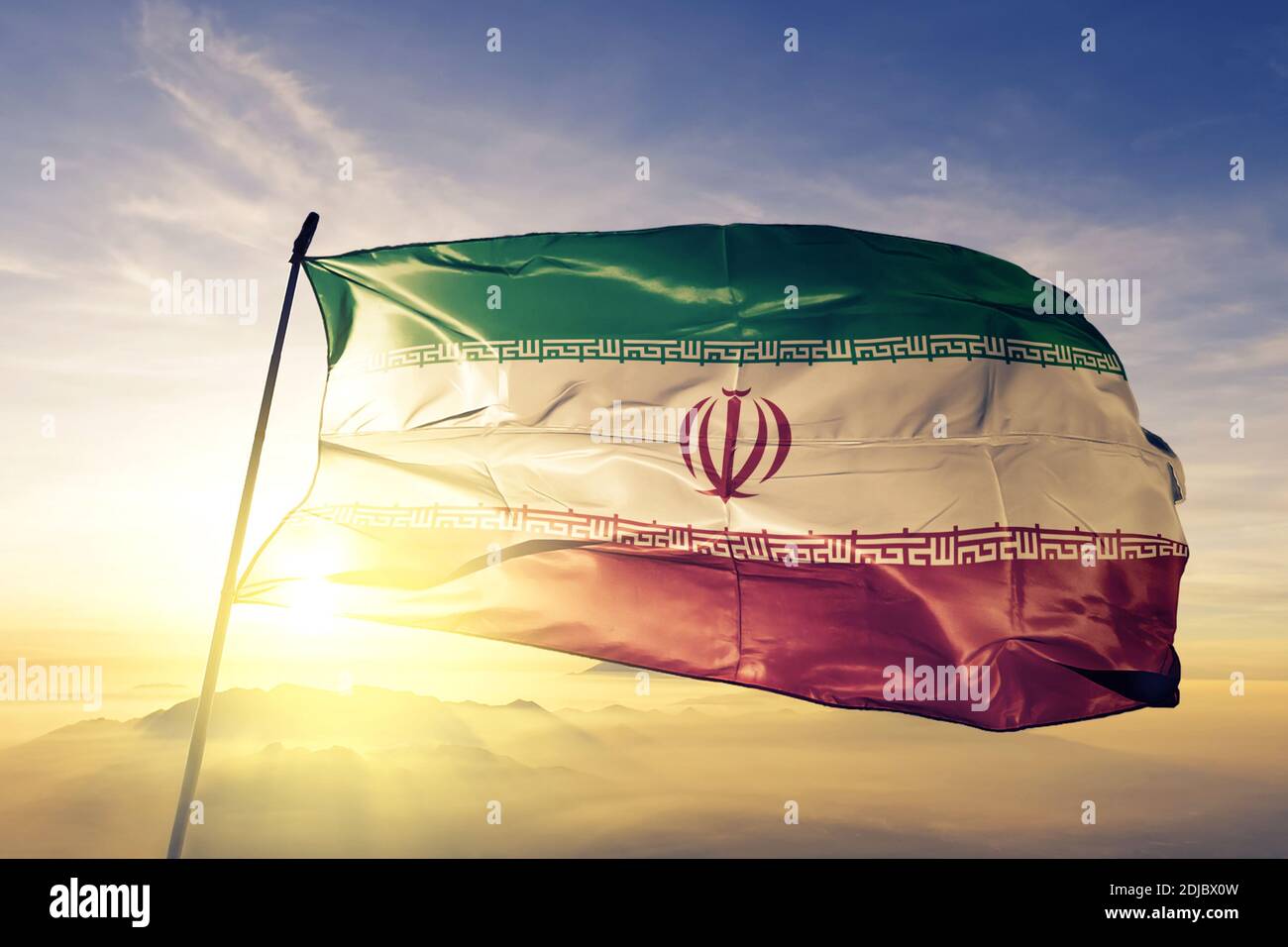 Iran flag waving on the top sunrise mist fog Stock Photo - Alamy