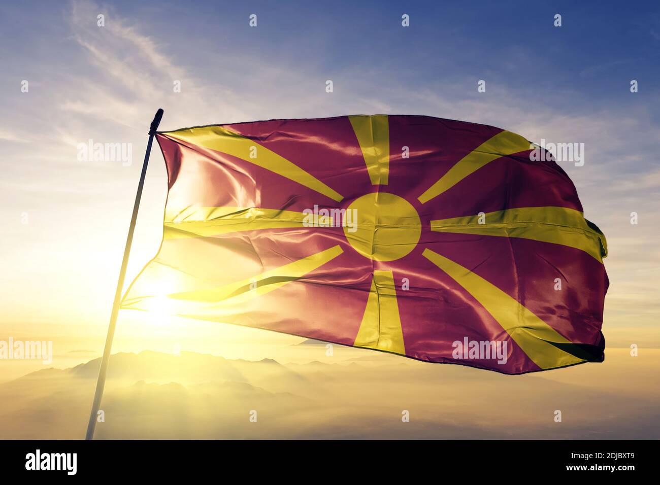 Macedonia flag waving on the top sunrise mist fog Stock Photo - Alamy