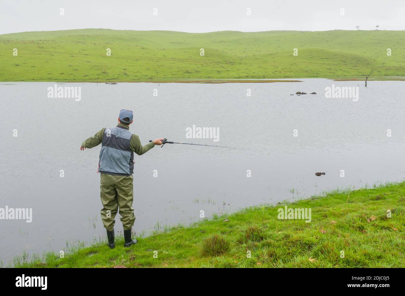 Black bass fisherman fishing Stock Photo - Alamy