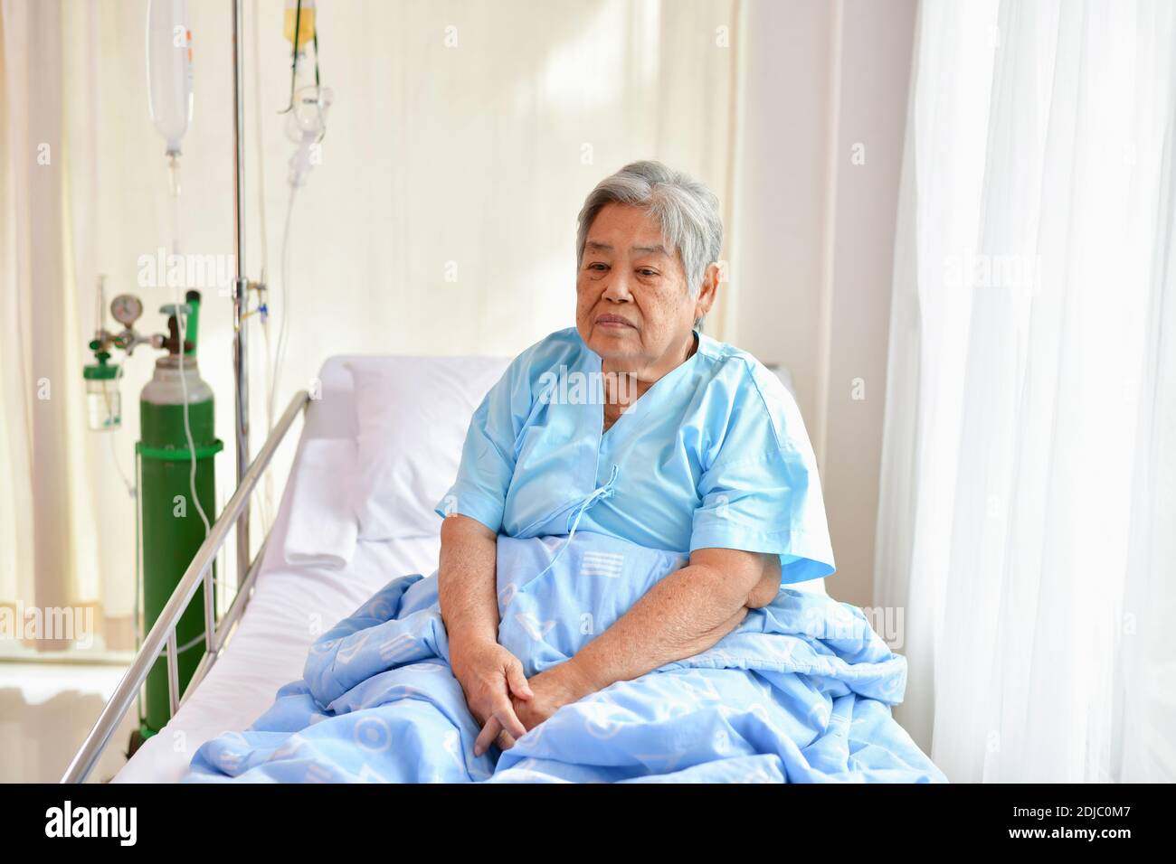 Sad senior women bed hi-res stock photography and images - Alamy