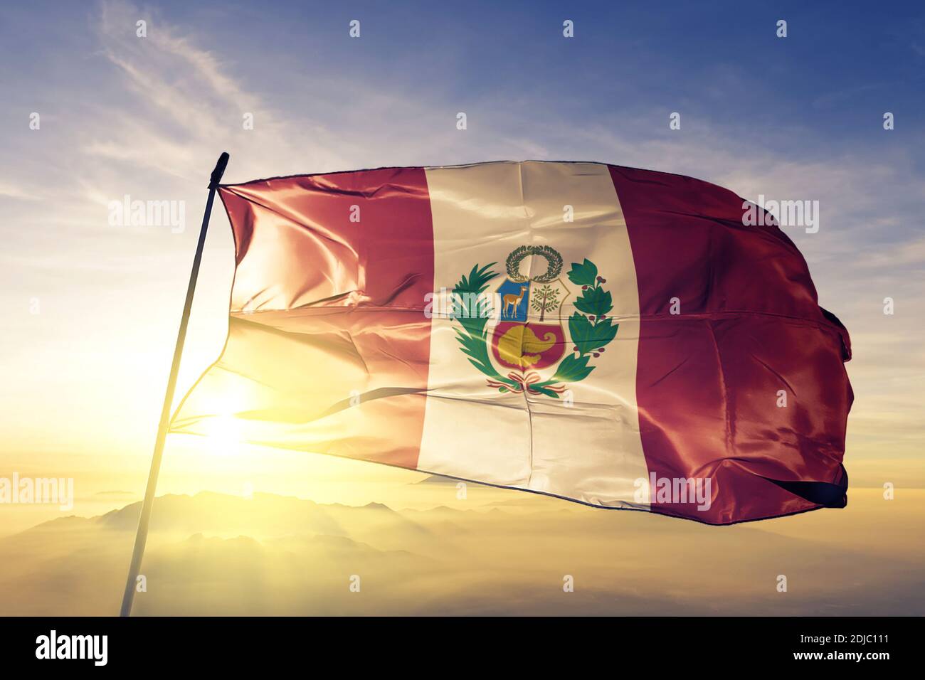 Peru flag waving on the top sunrise mist fog Stock Photo - Alamy