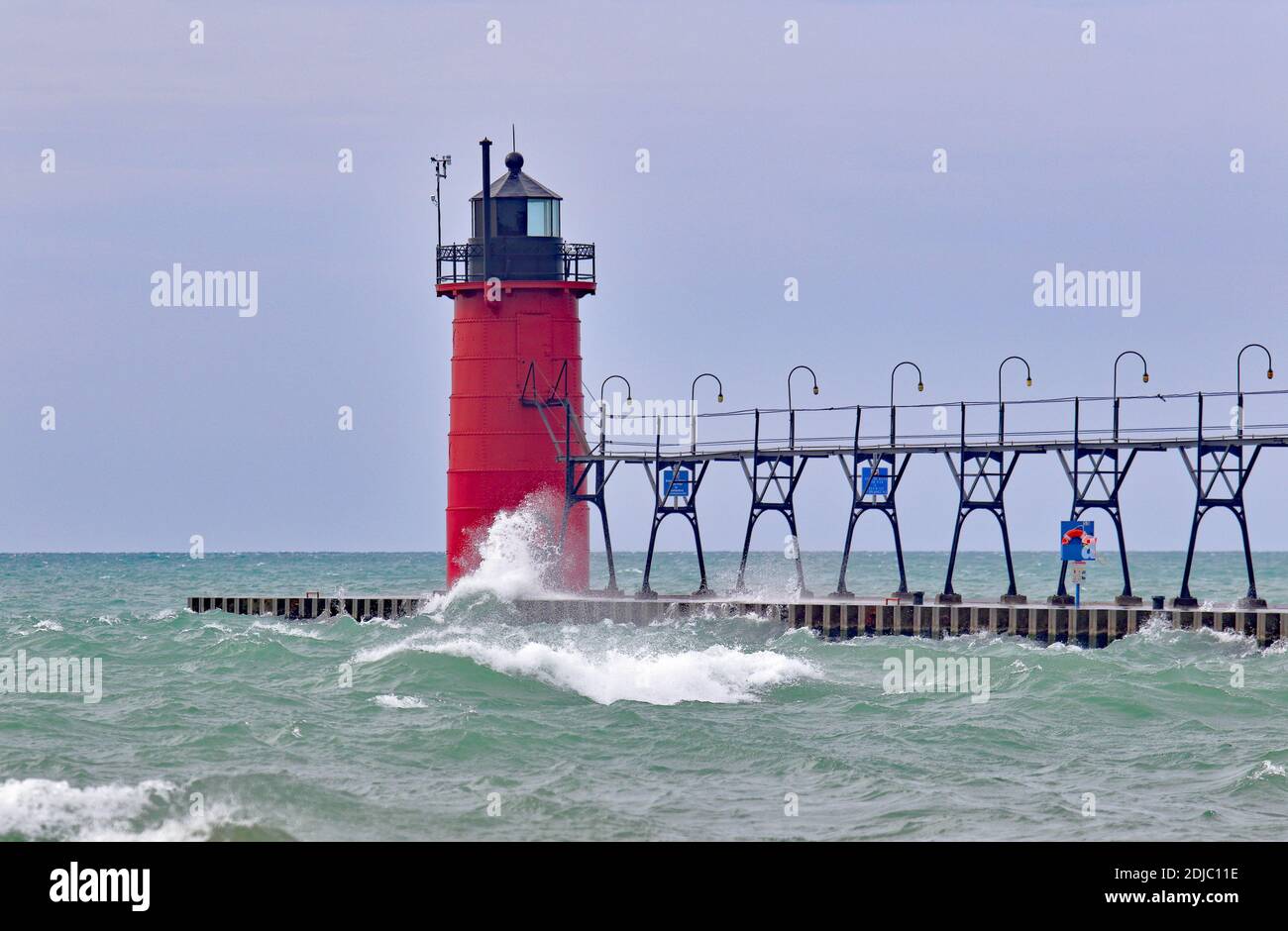 South Haven Lighthouse on a windy day with waves and spray Stock Photo ...