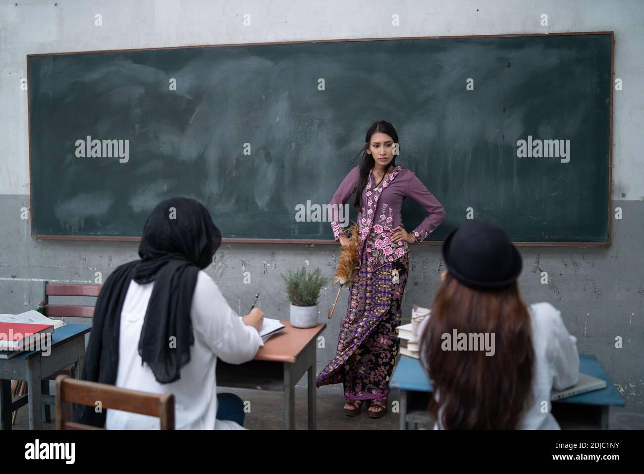 Angry teacher in classroom hi-res stock photography and images - Alamy