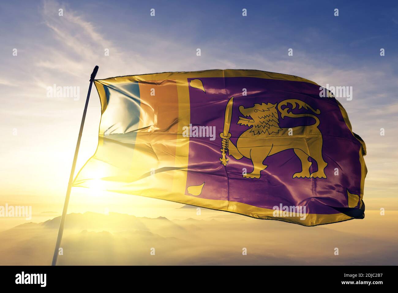 Sri Lanka flag waving on the top sunrise mist fog Stock Photo - Alamy