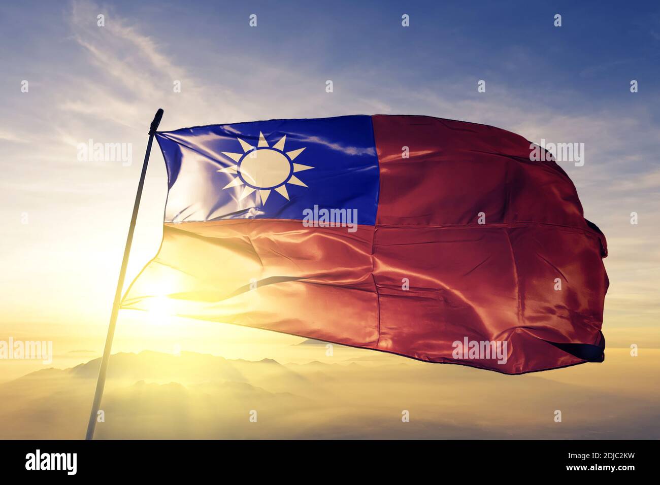 Taiwan flag waving on the top sunrise mist fog Stock Photo - Alamy