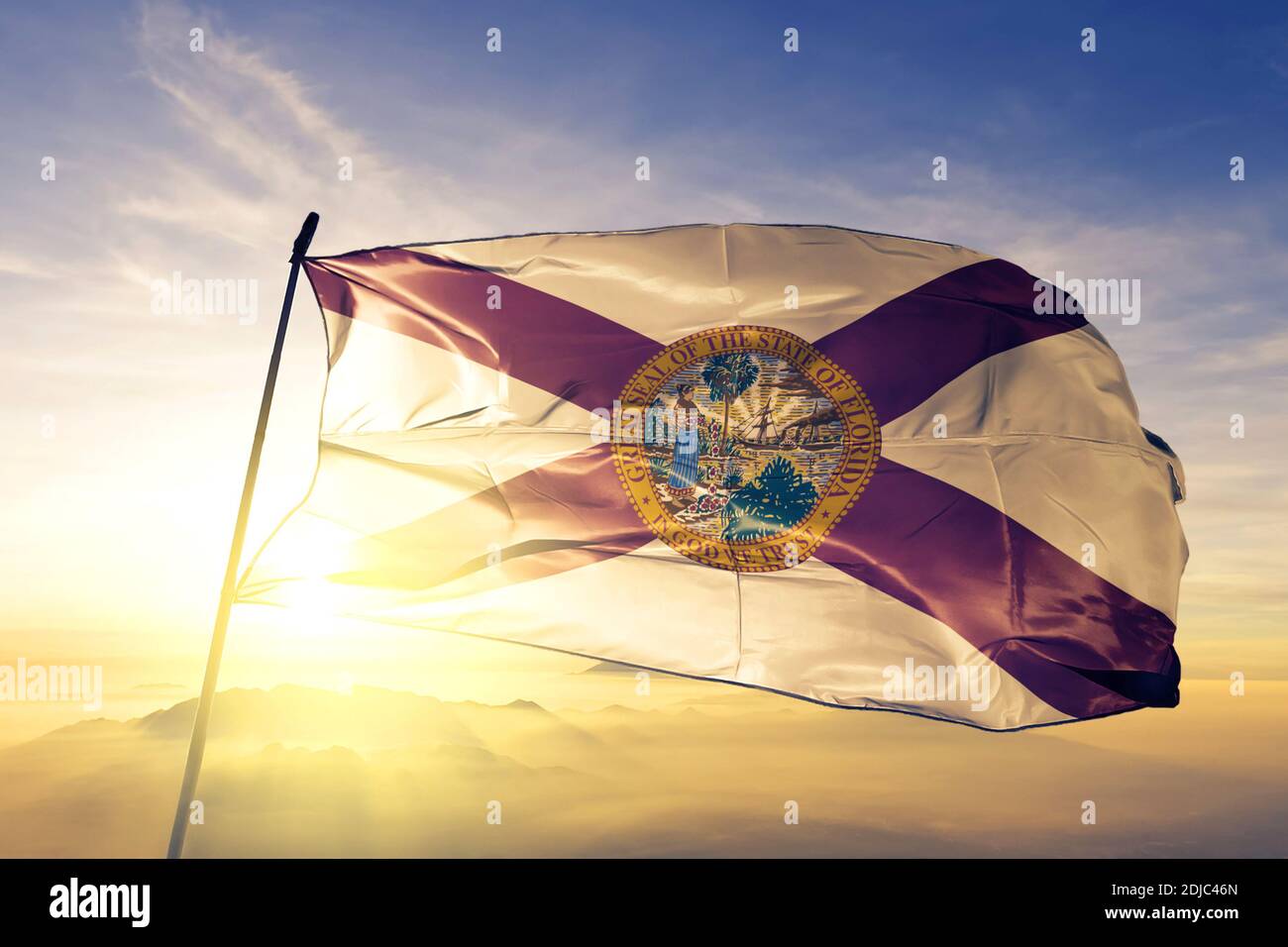 Florida state of United States flag waving on the top sunrise mist fog ...