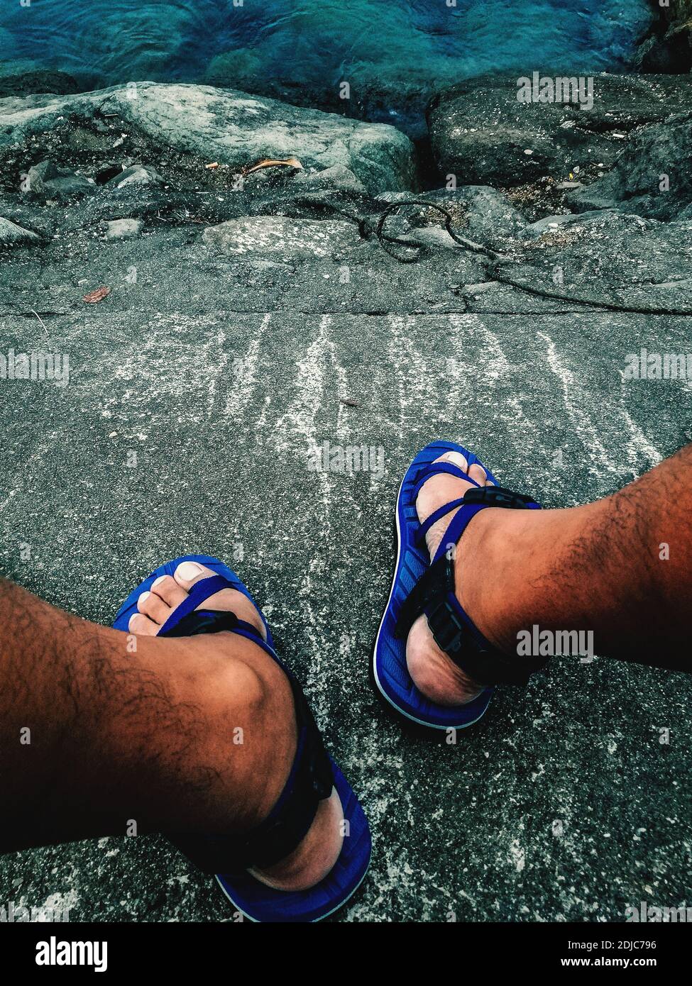 Wearing blue sandals hi-res stock photography and images - Alamy