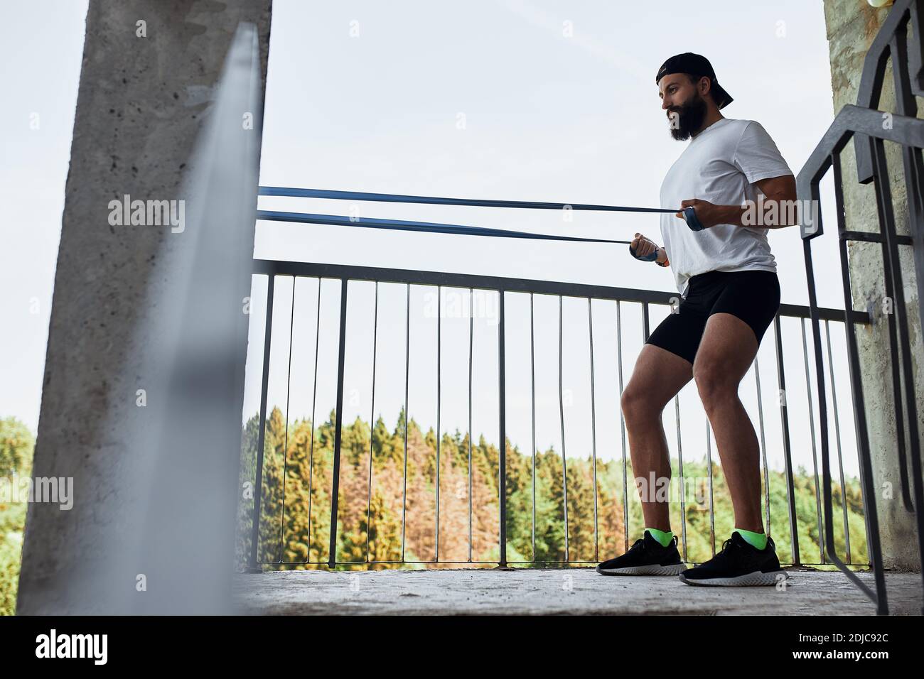 Concentrated male athlete running up stairs to make training more ...