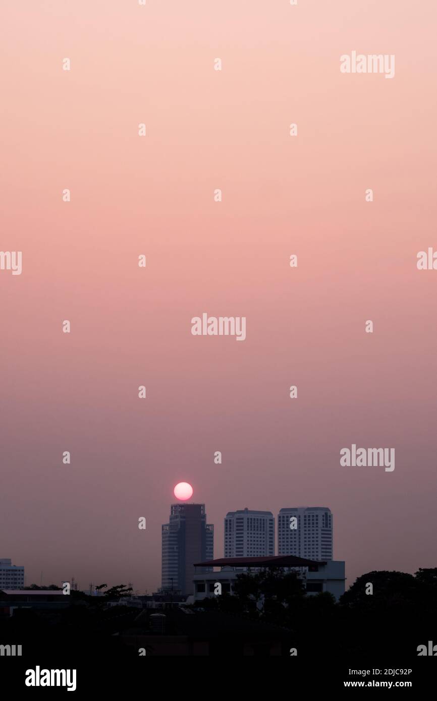 Light of the sun behind the high-rise building in the morning Stock ...
