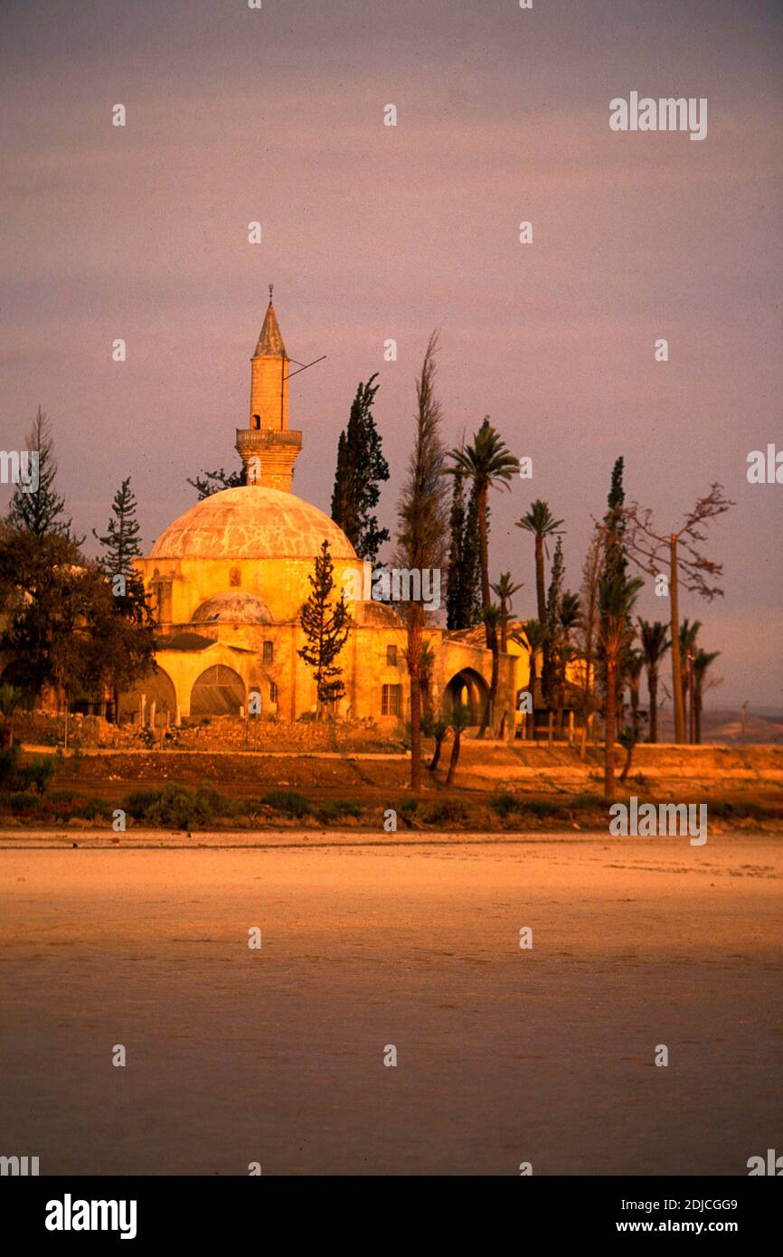 the mosque Hala Sultan Tekke at the landscape of a salt lake near the ...