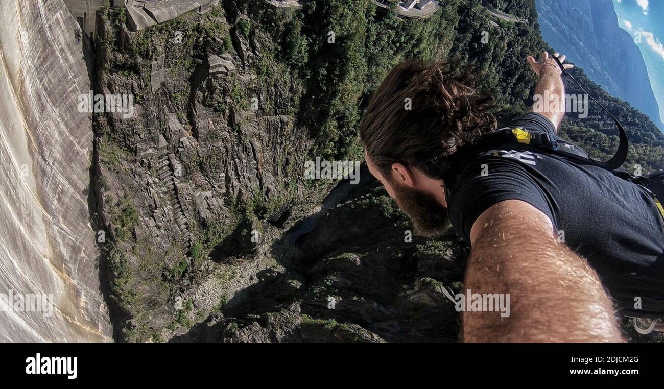 Man Bungee Jumping Over Rock Formations Stock Photo - Alamy