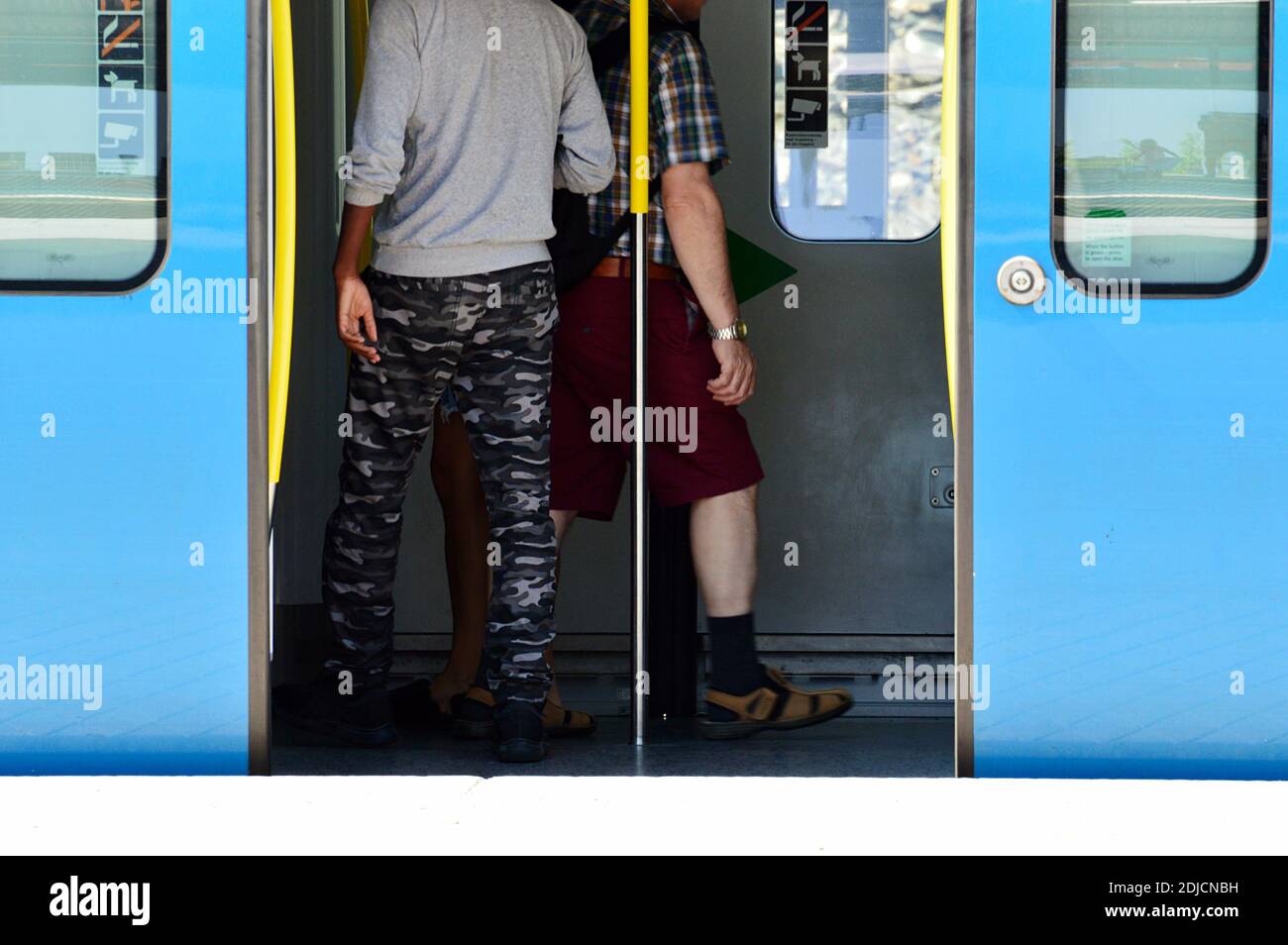 Two men waiting for the subway hi-res stock photography and images - Alamy
