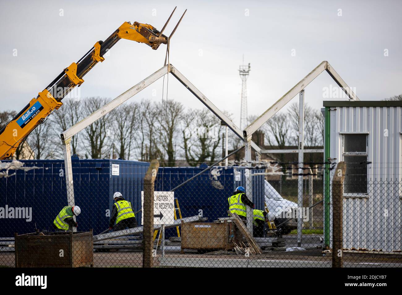 Construction workers are building a temporary Border Control Post (BCP ...