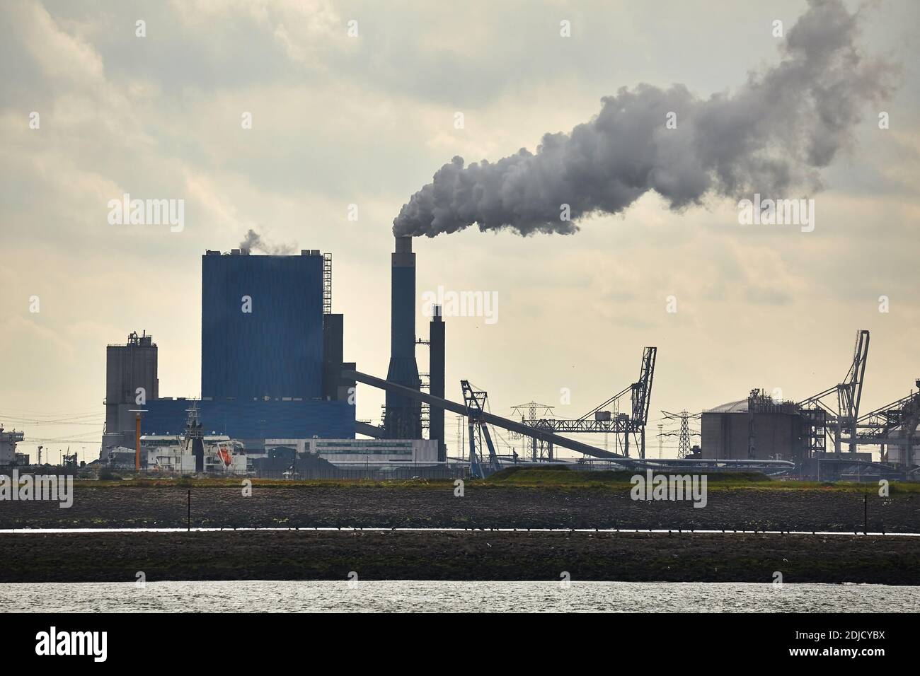 Smoking power plant Stock Photo - Alamy