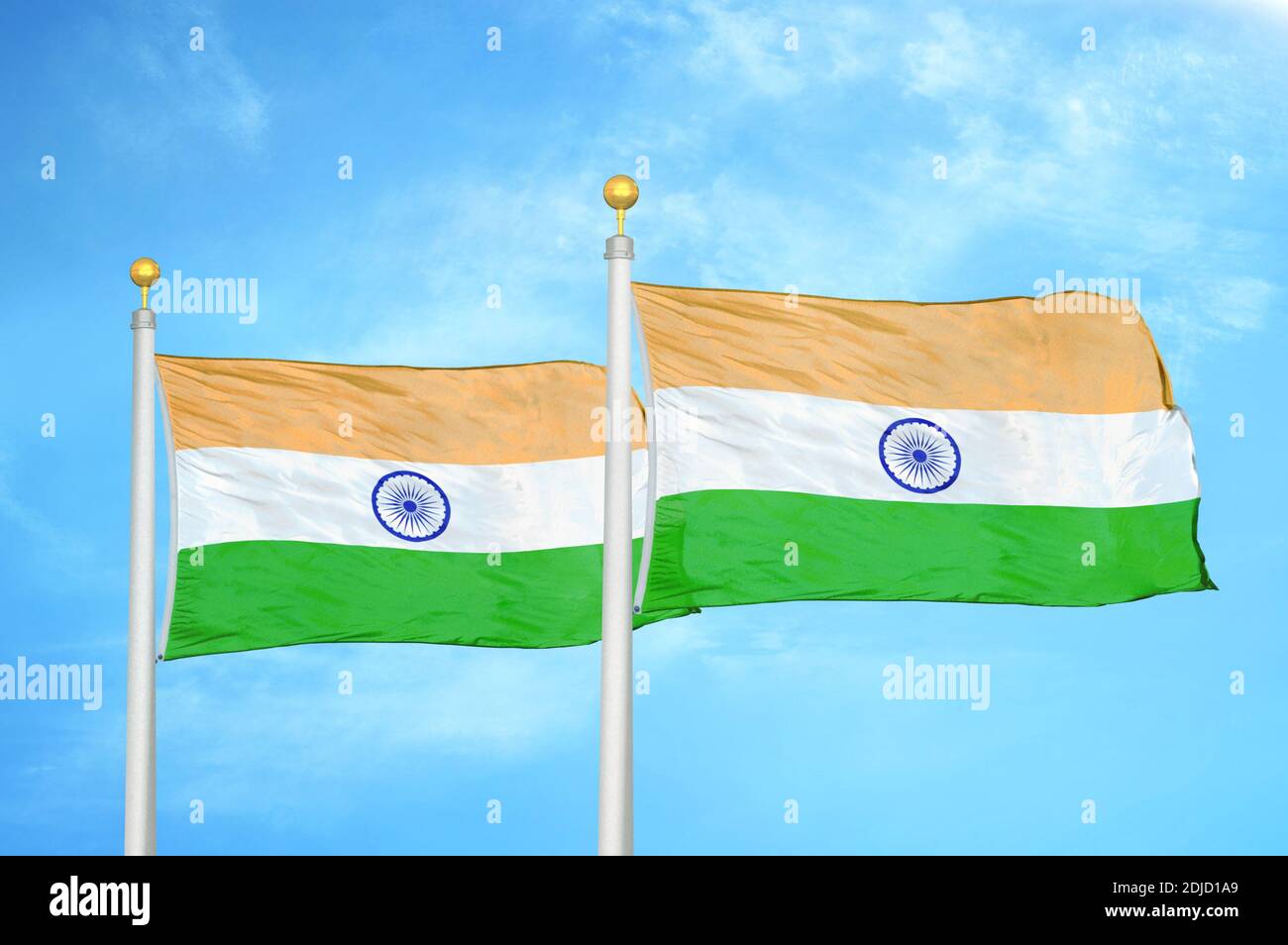 India two flags on flagpoles and blue cloudy sky Stock Photo - Alamy