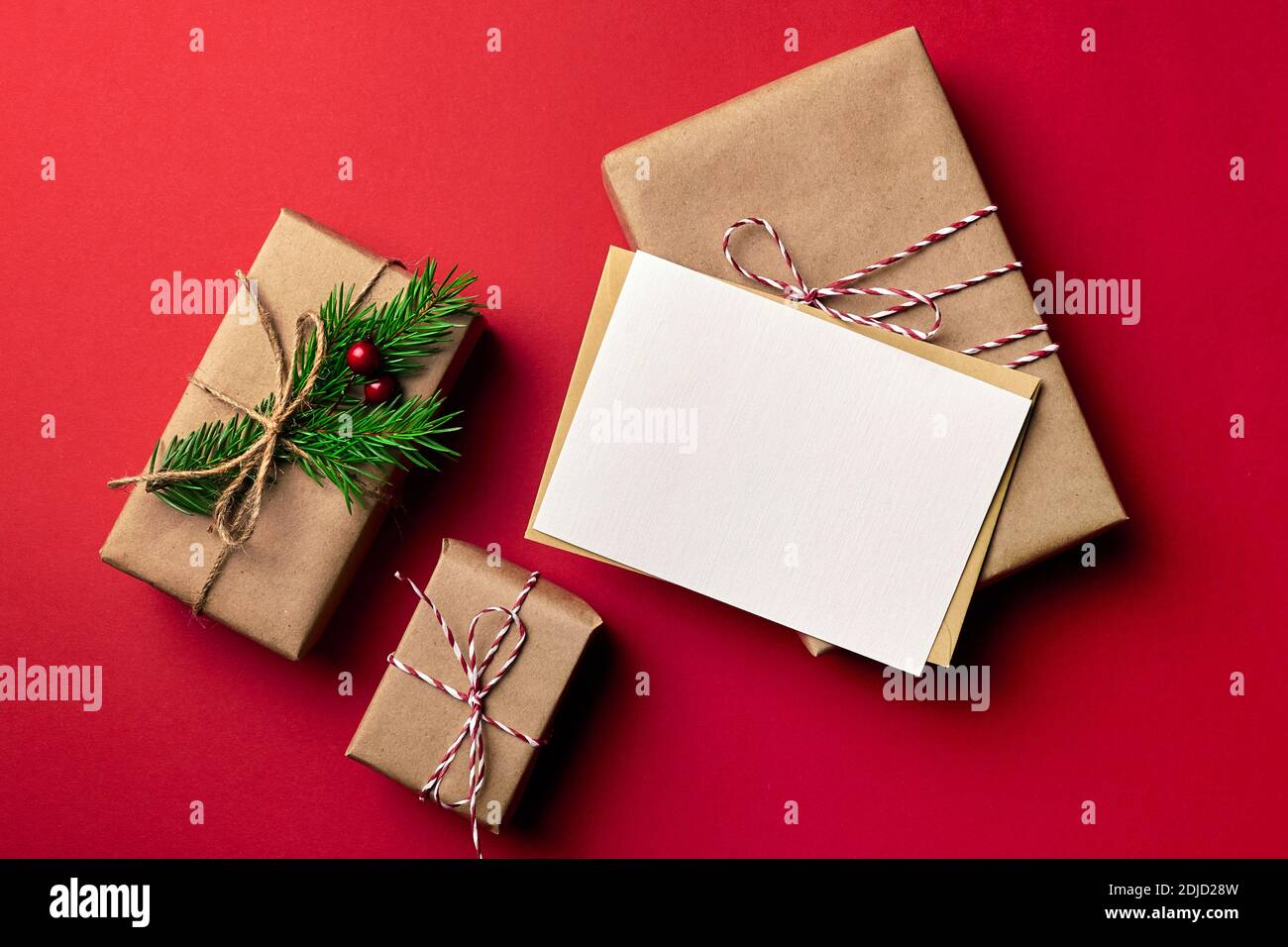 Christmas greeting card mockup. Decorated gift boxes and card with ...