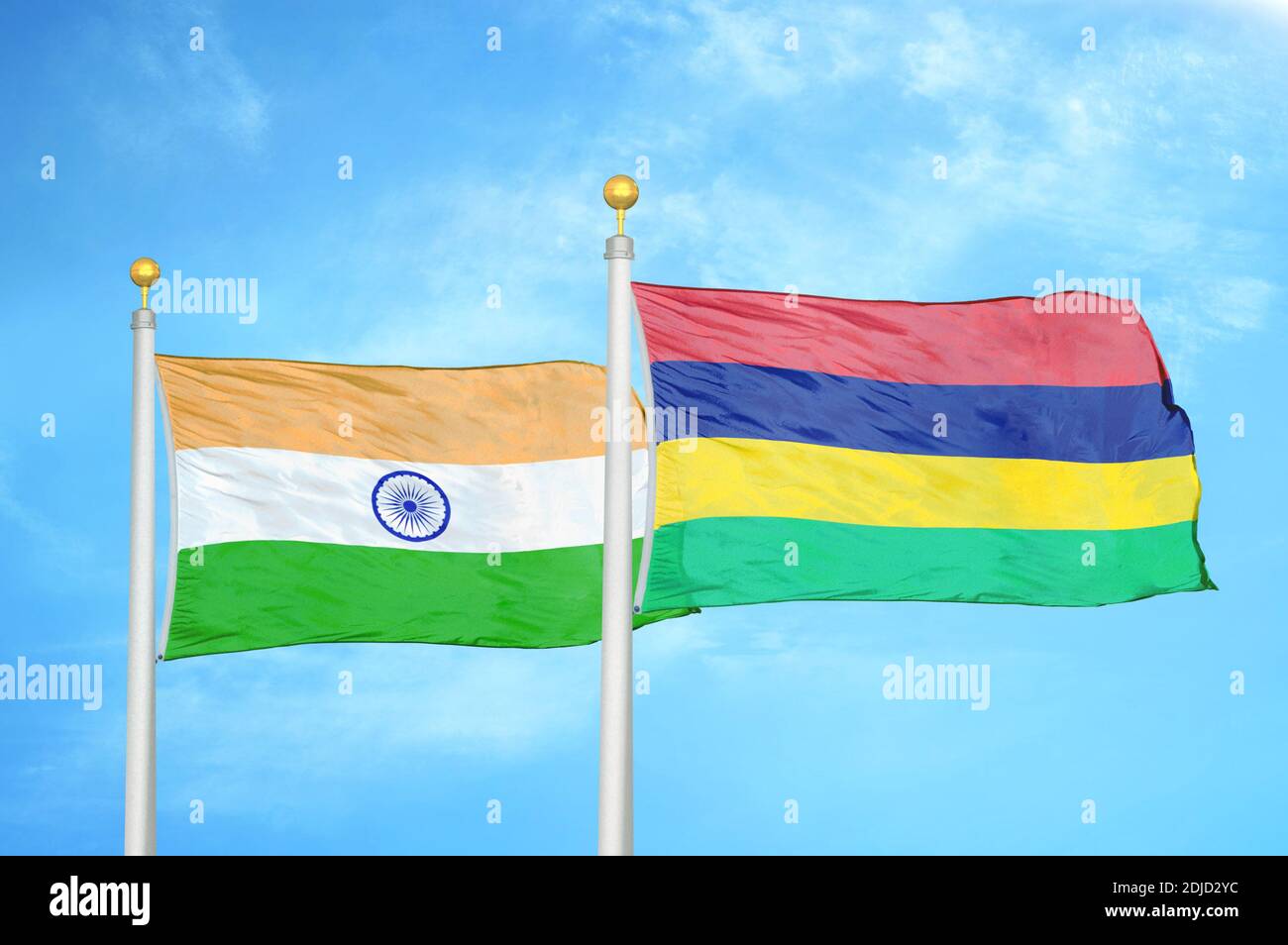 India and Mauritius two flags on flagpoles and blue cloudy sky Stock ...