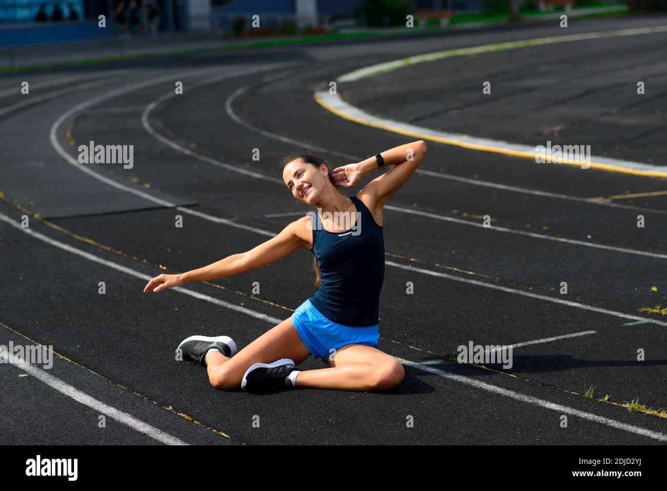 Athlete runner running on athletic track training her cardio. Woman ...