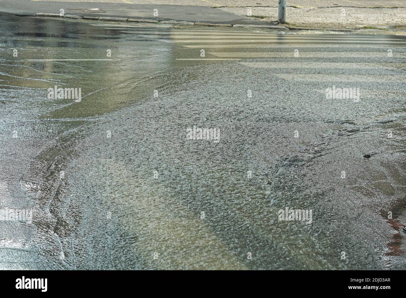 Stream of water at street floods in city Stock Photo - Alamy